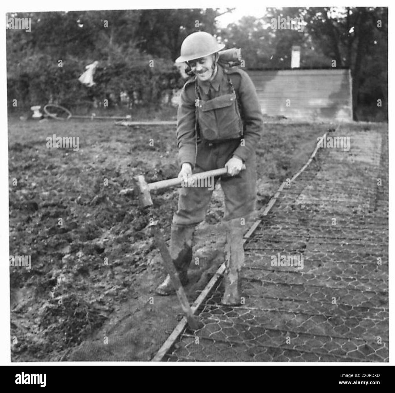 PHOTOGRAPHS OF EQUIPMENT - Sommerfeld 8 lb. angle iron picket being ...
