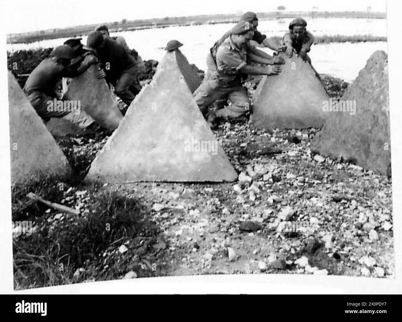 British Army reconnaissance troops are removing tank obstacles from a ...