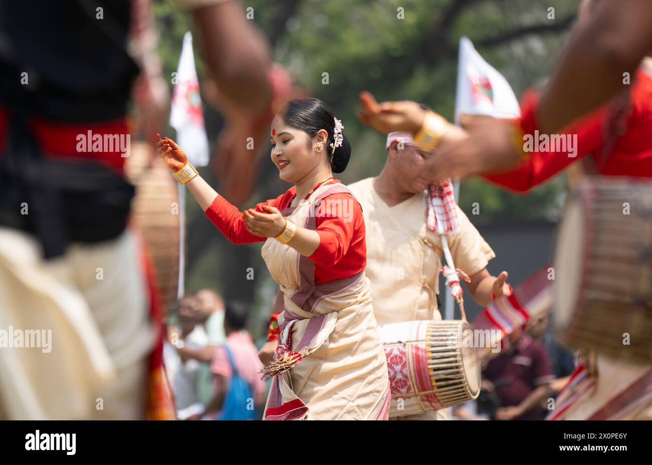 April 13, 2024: Young men and women in traditional attire performs Bihu ...