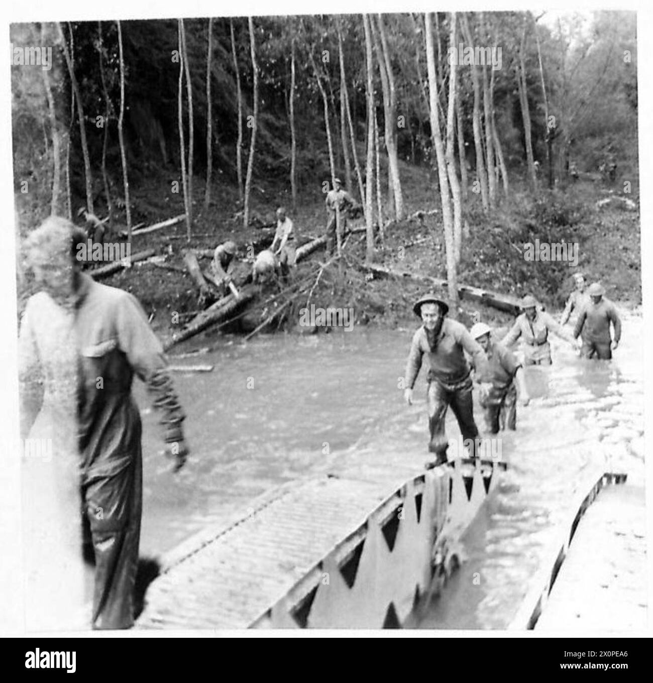 Sappers of No. A Platoon, 221 Field Engineering Company, wade waist ...