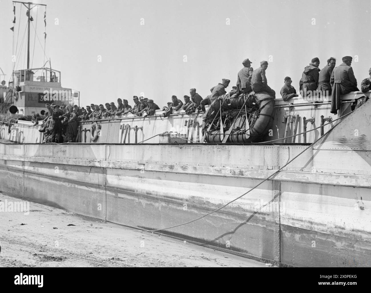 German prisoners, mostly conscripted Poles and Ukrainians, wait in a ...