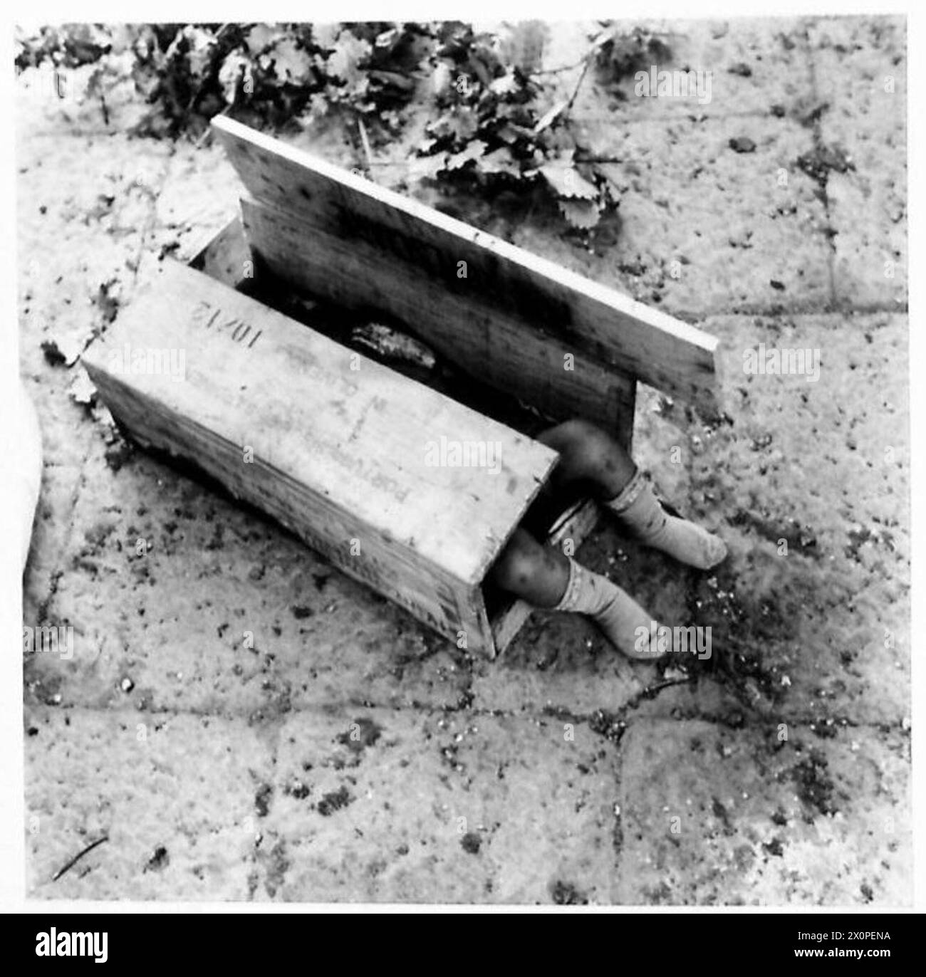 The body of a baby is found in a box following a German atrocity at ...