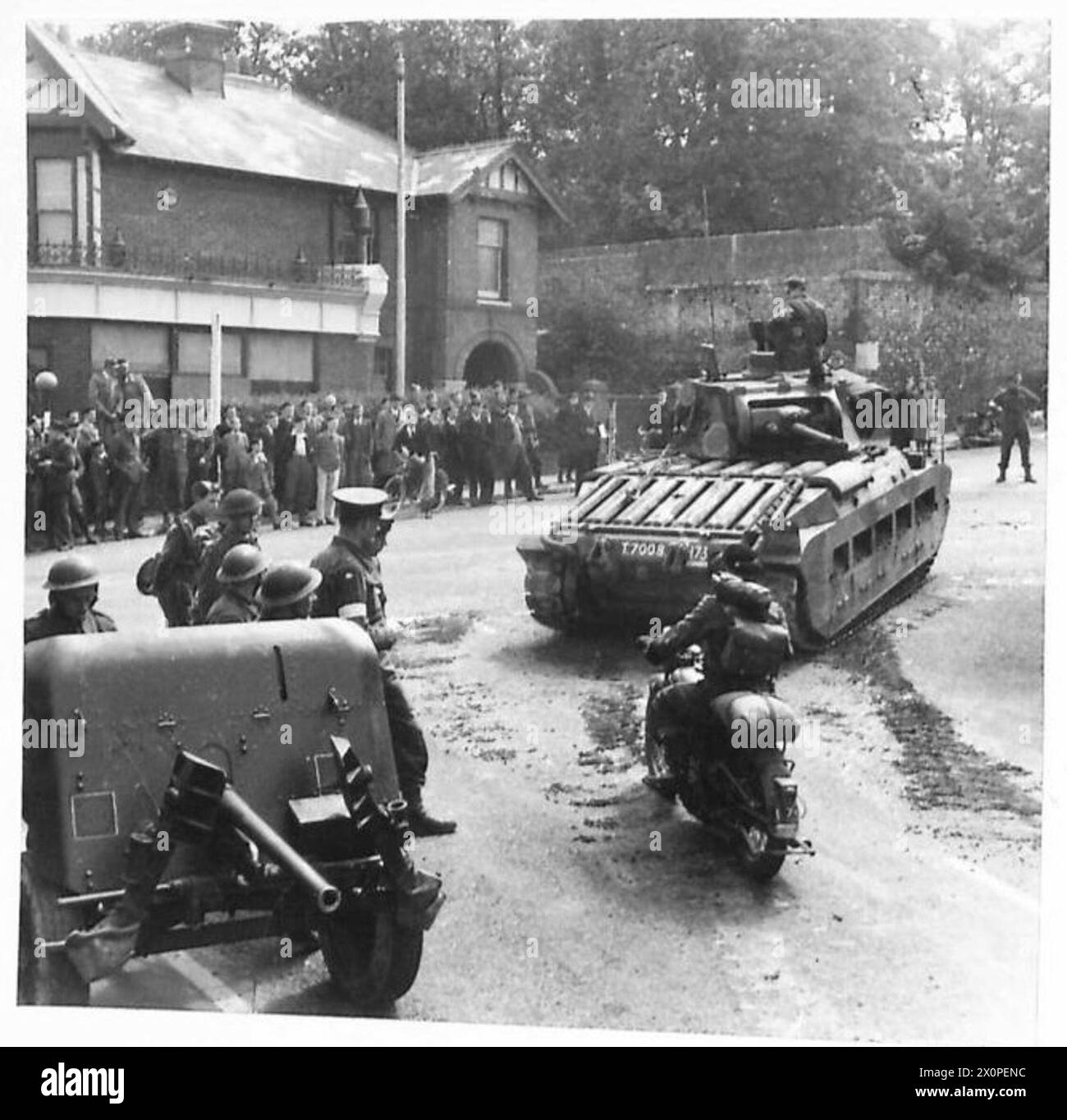 During a mock invasion exercise, simulated enemy tanks advance into a ...
