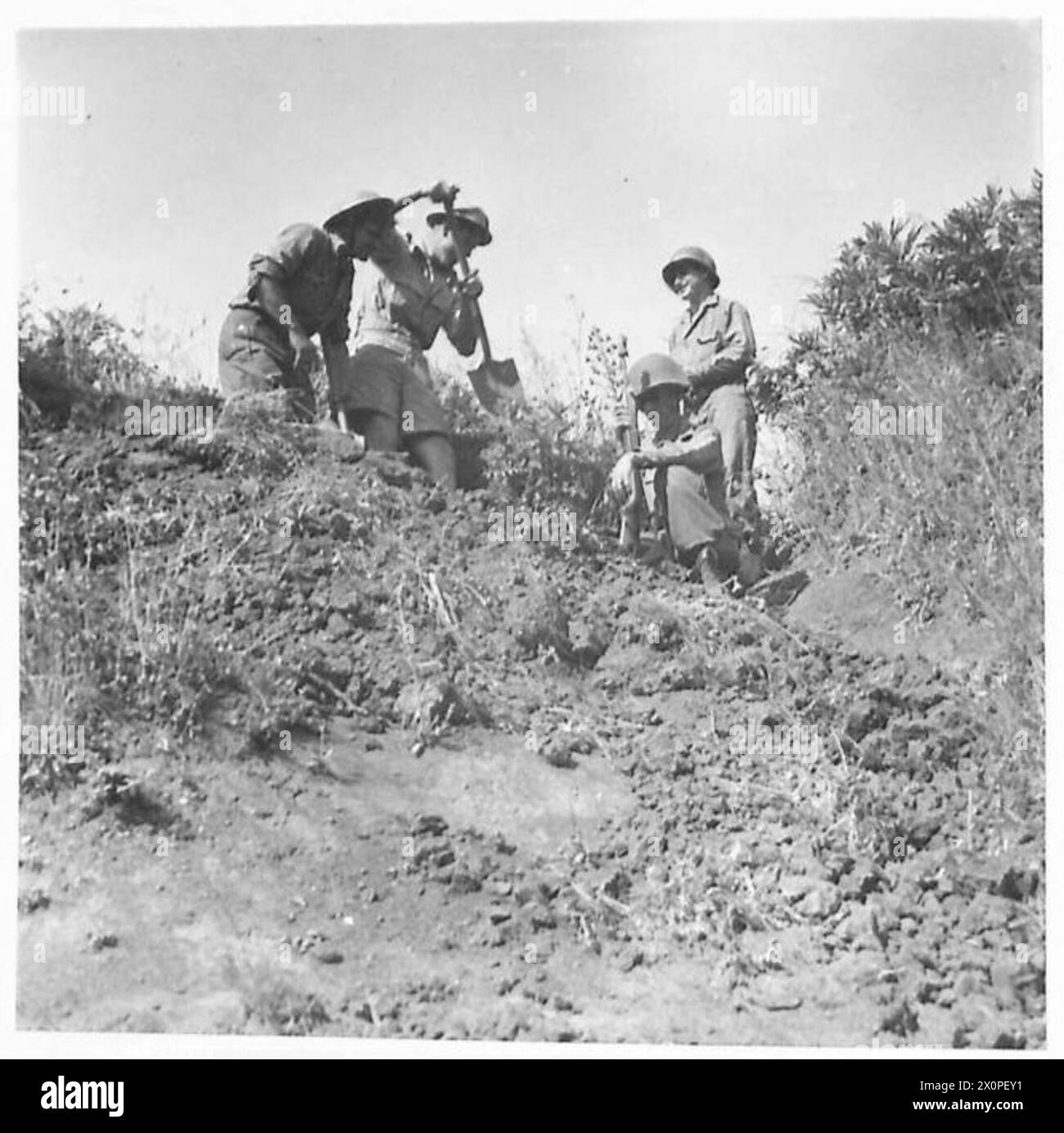 British and American soldiers cooperate on a hillside near Artena ...