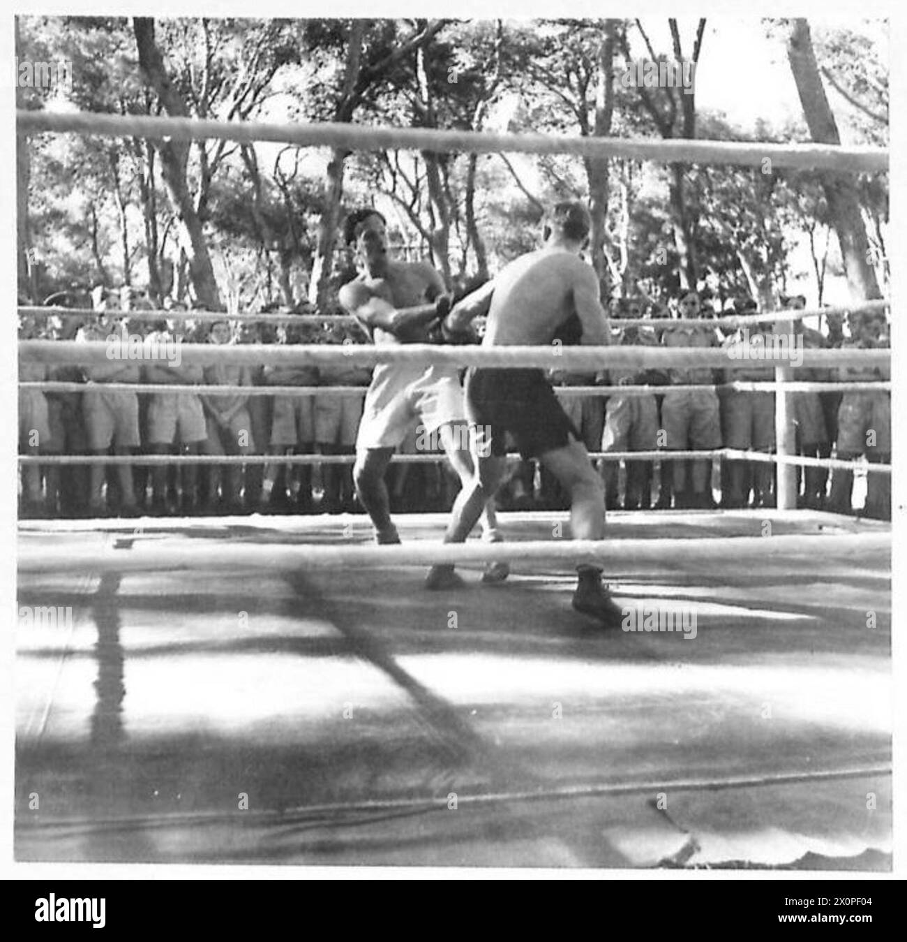 Two sergeant instructors engage in a boxing bout at a convalescent home ...