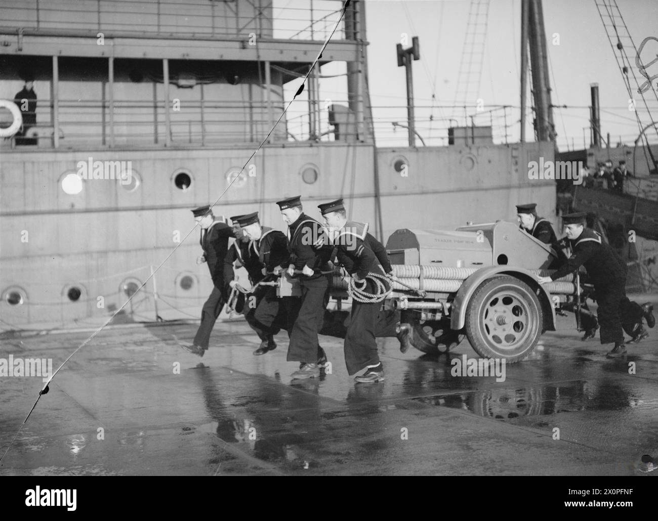 MEN OF THE ROYAL NAVY UNDERGOING TRAINING IN FIRE FIGHTING AT A NAVAL ...