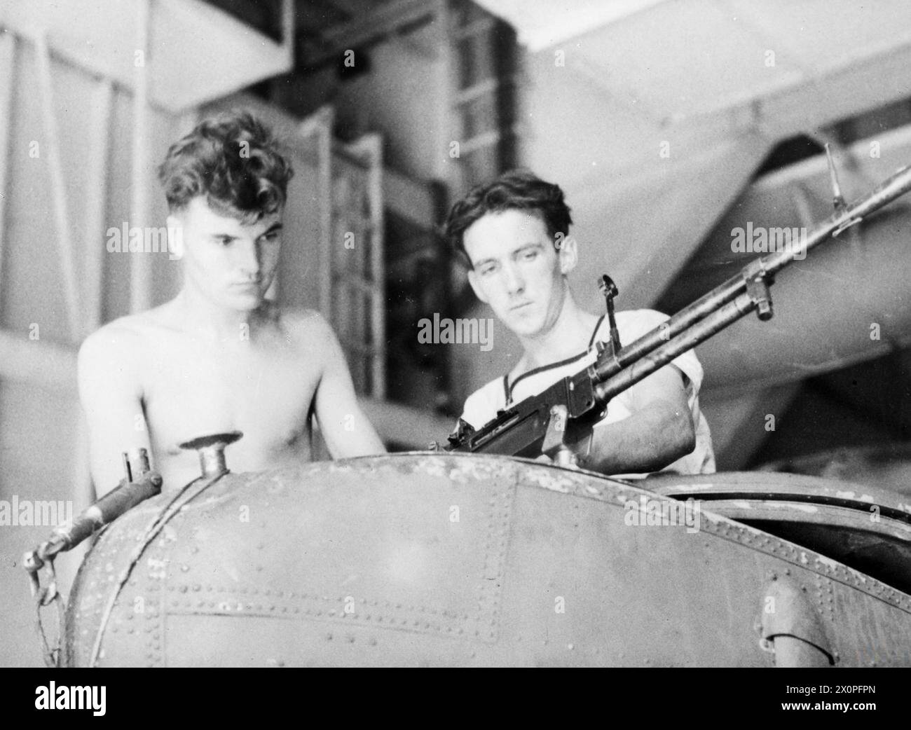 AN ARMOURER'S LIFE AFLOAT. SEPTEMBER 1944, ON BOARD THE ESCORT CARRIER ...