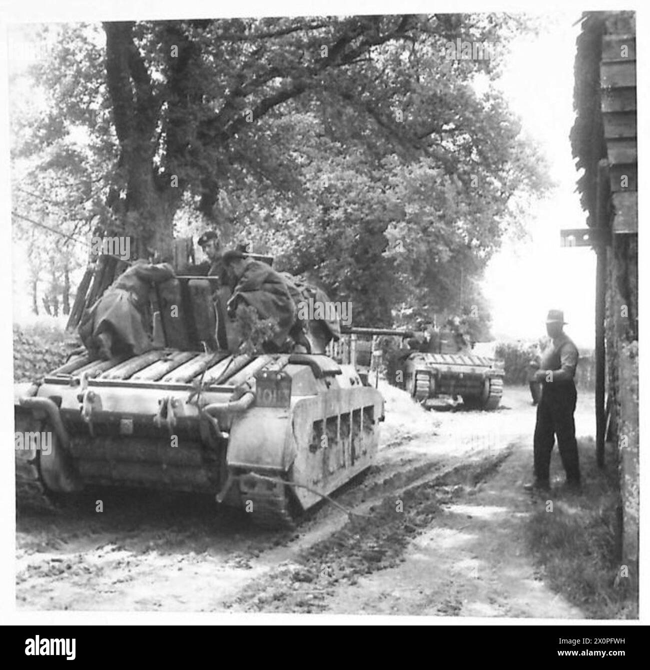 Enemy tanks are shown entering a farmyard during a British Army mock ...