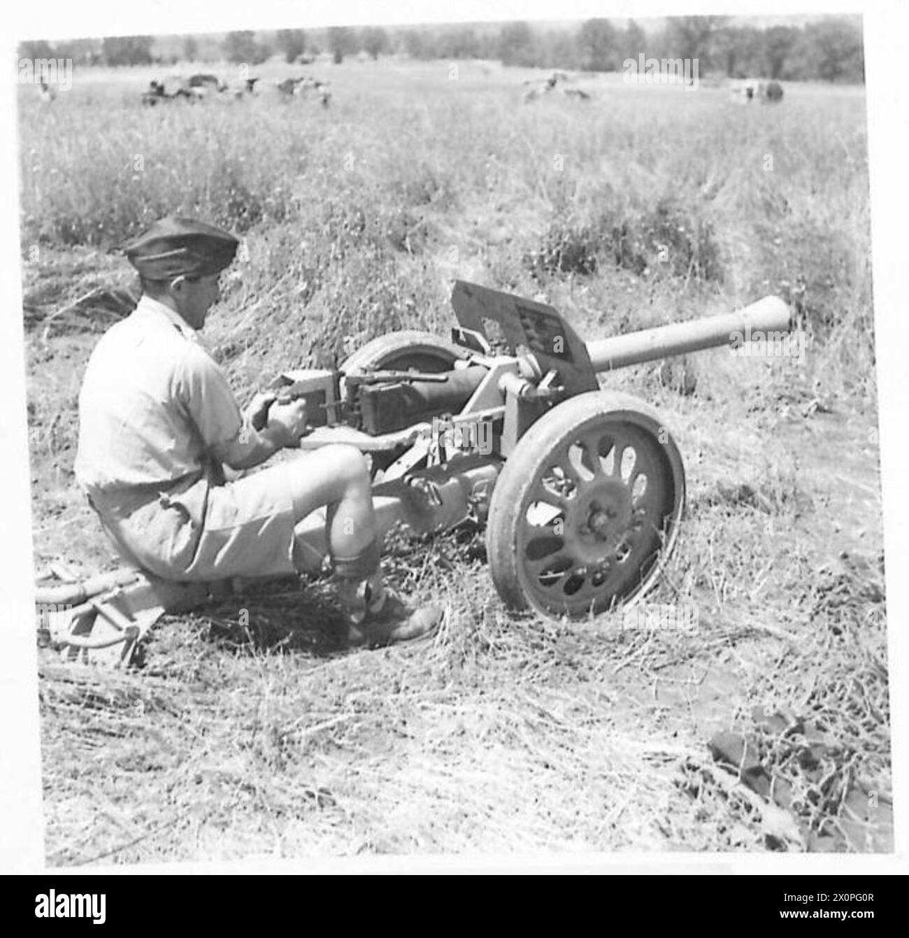 A soldier observes a 8.8 cm Tocket Projector Pueppchen, a larger rocket ...