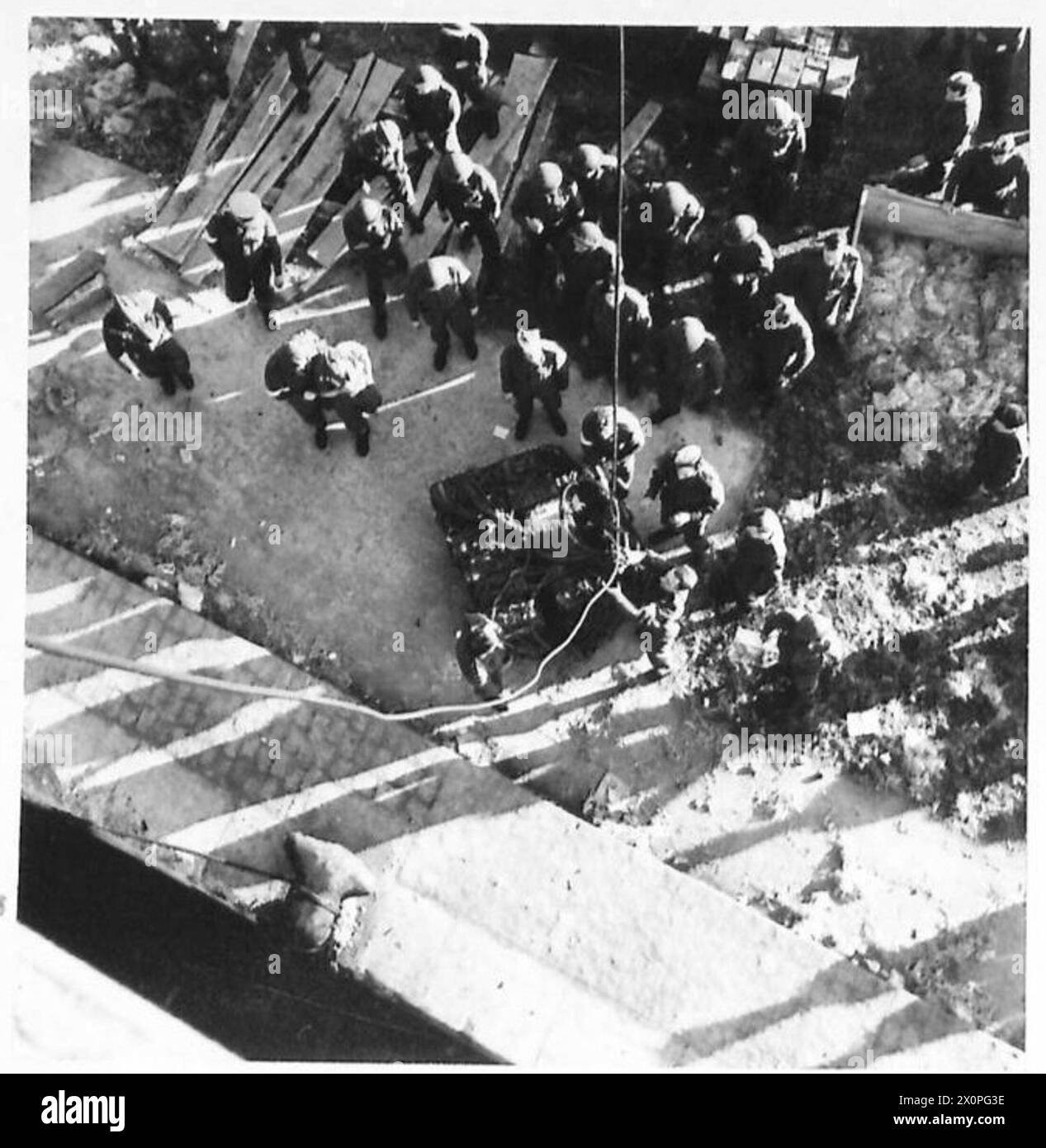 British troops unload supplies from the Royal Navy transport ship HMT ...