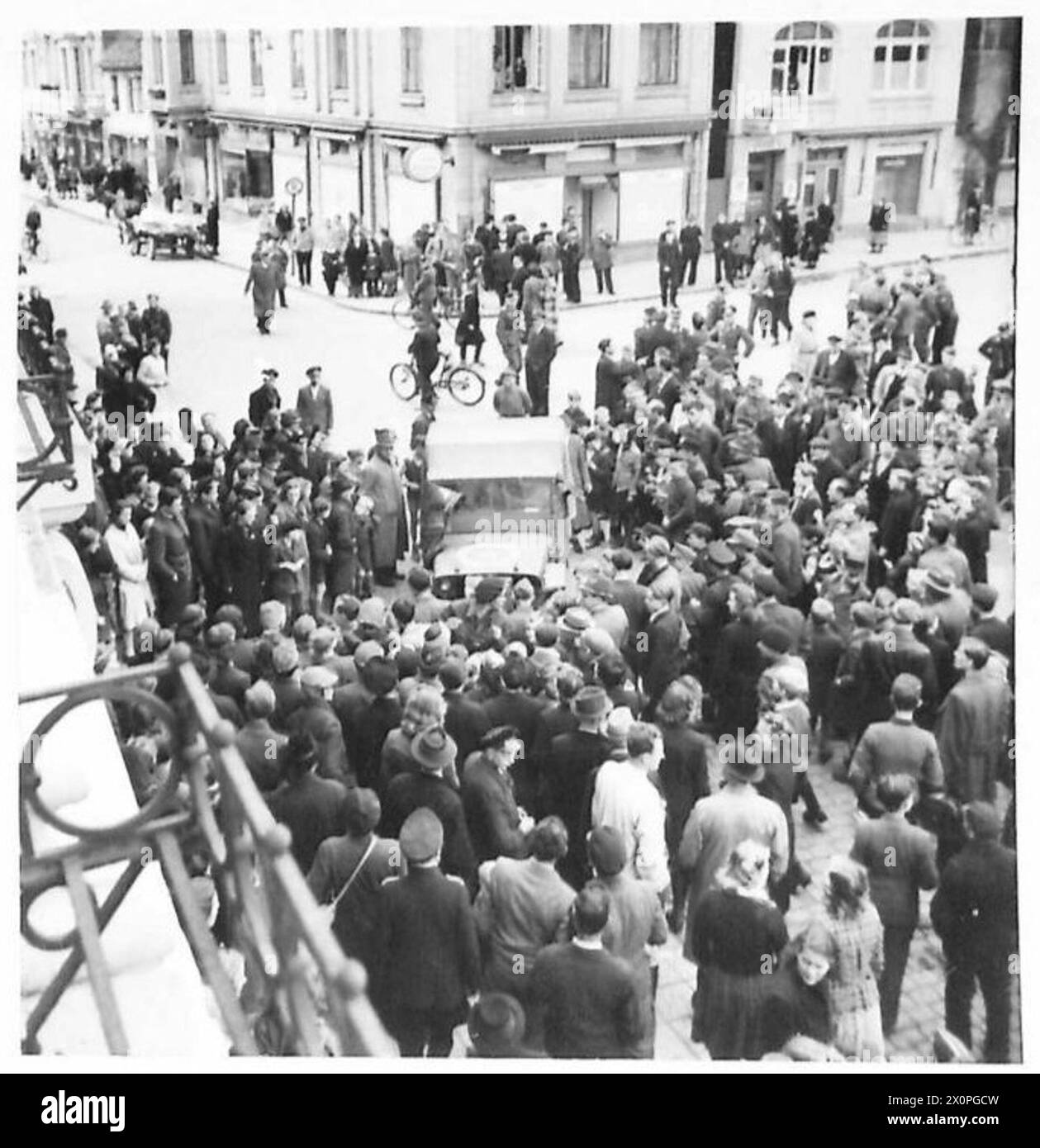 Photograph of German troops and civilians surrounding A.F.P.U ...