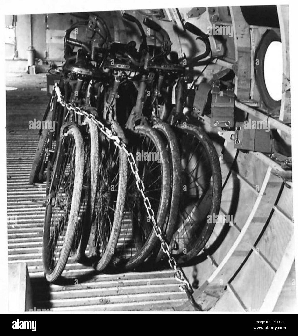 Photograph showing bicycles and other equipment lashed together inside ...