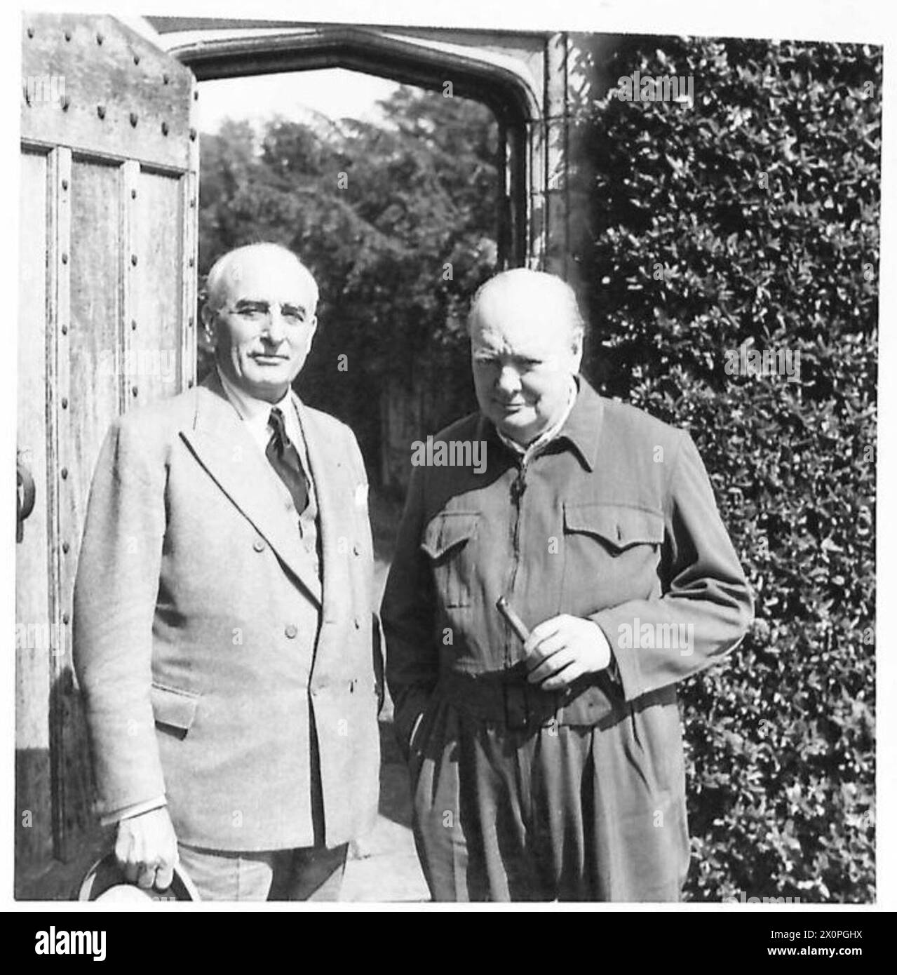 Mr. Churchill and Mr. Joseph E. Davies are pictured in the garden at ...