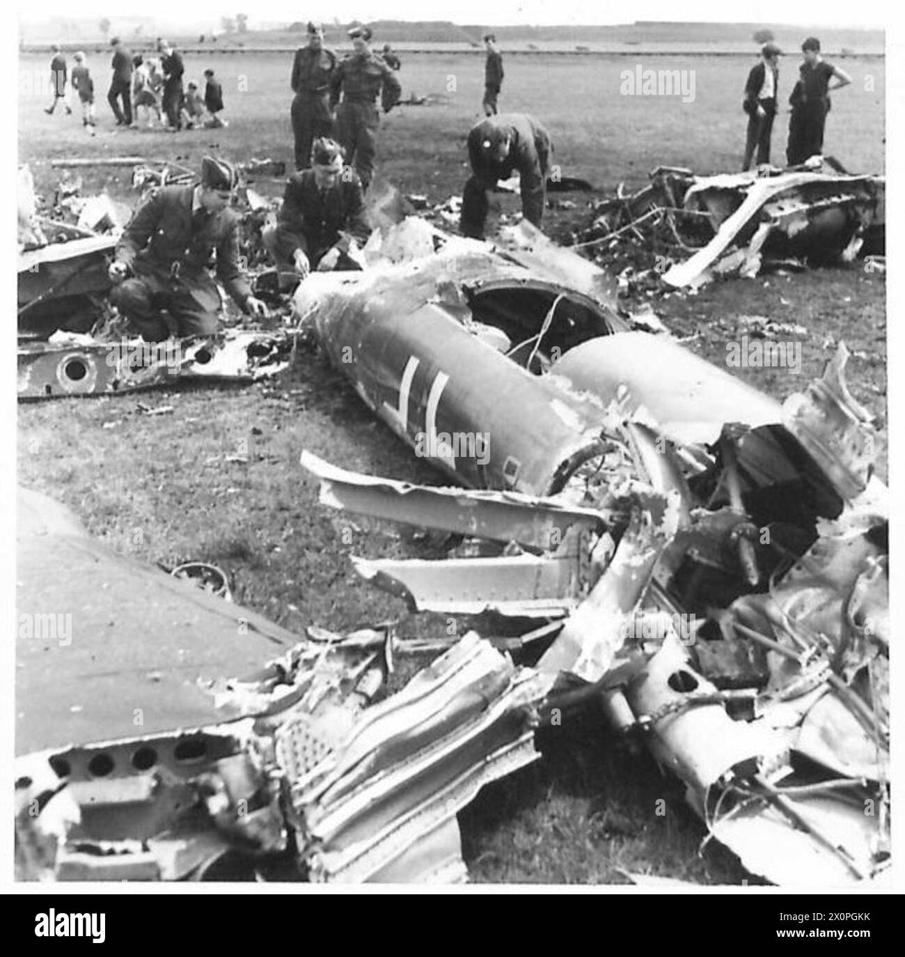 ANTI-AIRCRAFT GUNS DESTROY ENEMY RAIDER - R.A.F. personnel inspecting ...