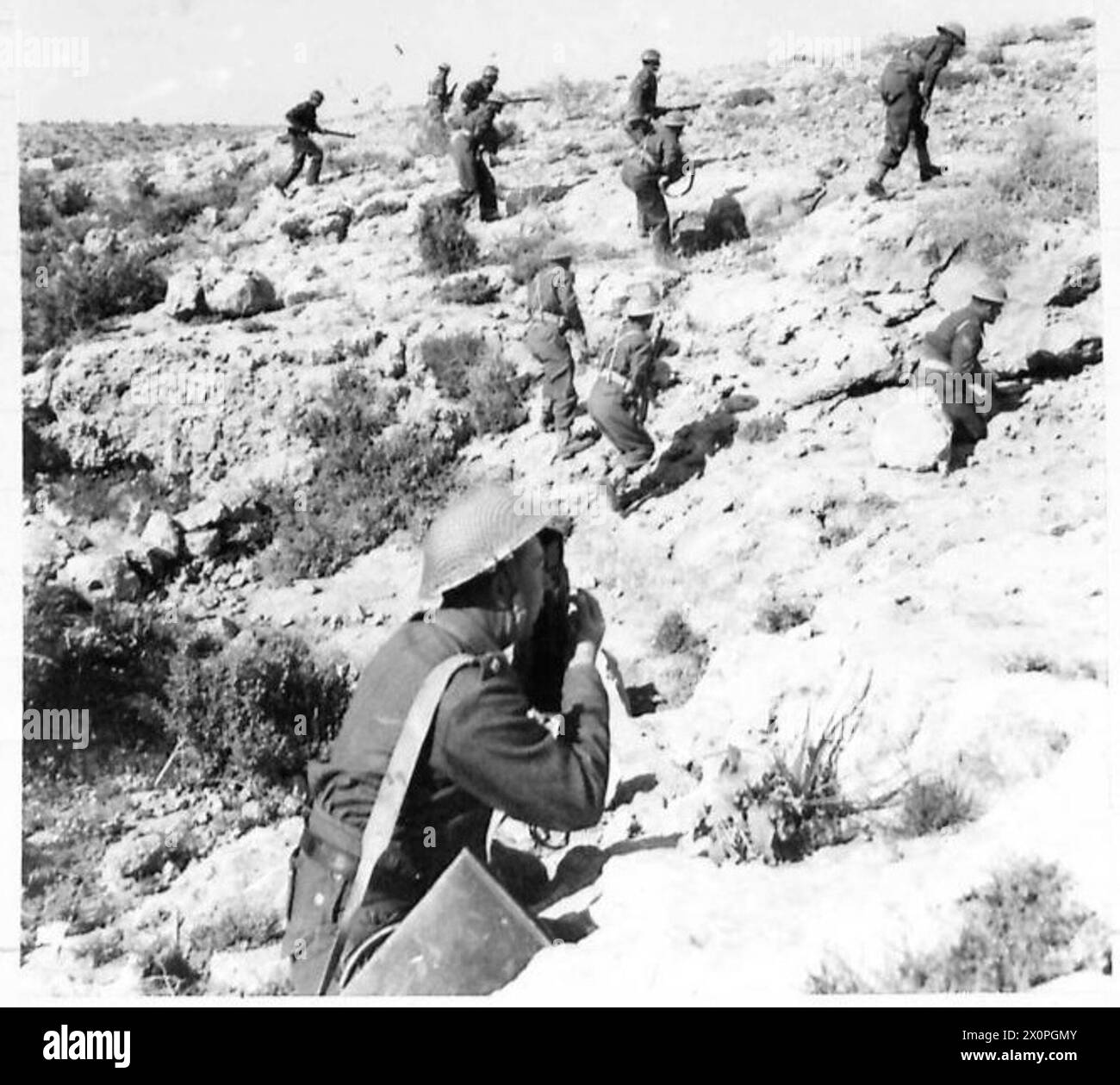 THE ARMY FILM AND PHOTOGRAPHIC UNIT - An A.F.P.U. cameraman heavily ...