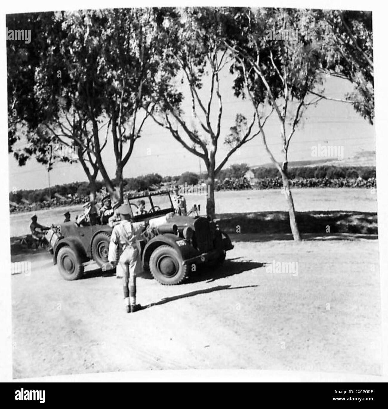 Photographic negative showing General Eisenhower arriving in his car to ...