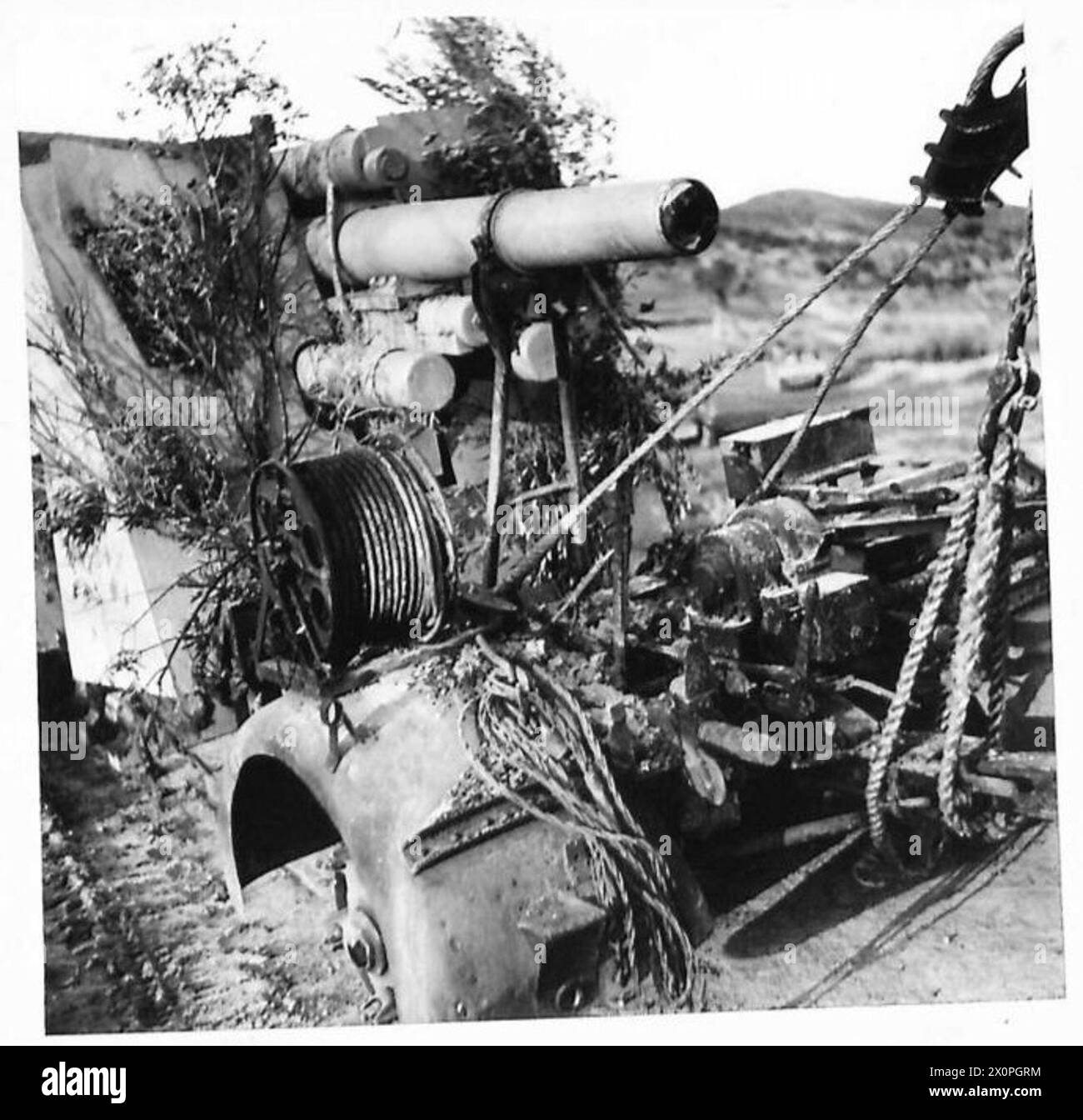 ON THE TUNISIAN FRONT - A German 88 mm gun, put out of action by a 2 ...