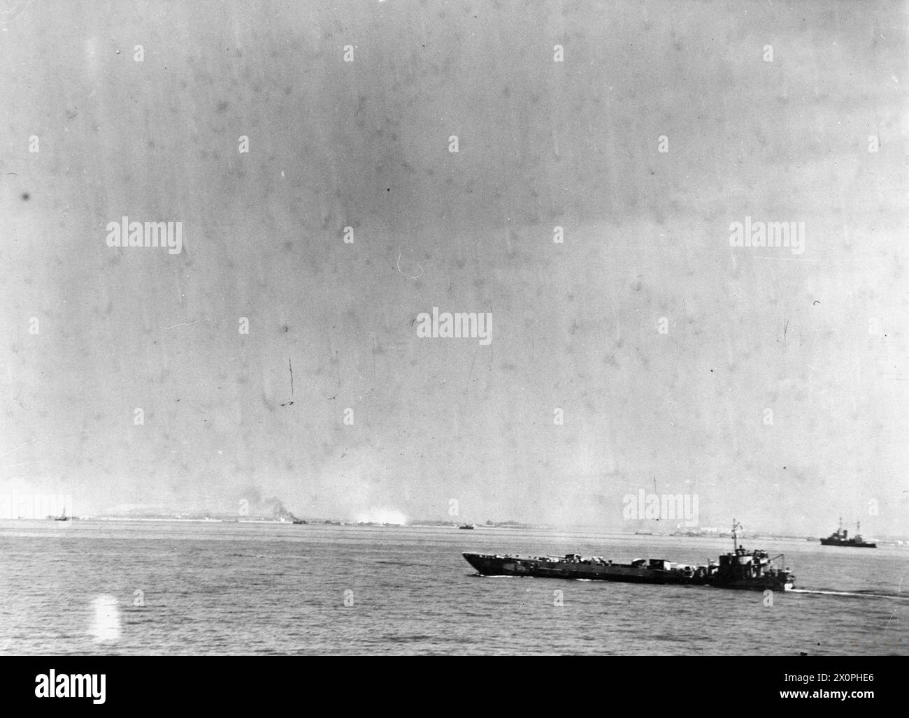British warships aboard HMS Cadmus bombard German shore batteries and ...