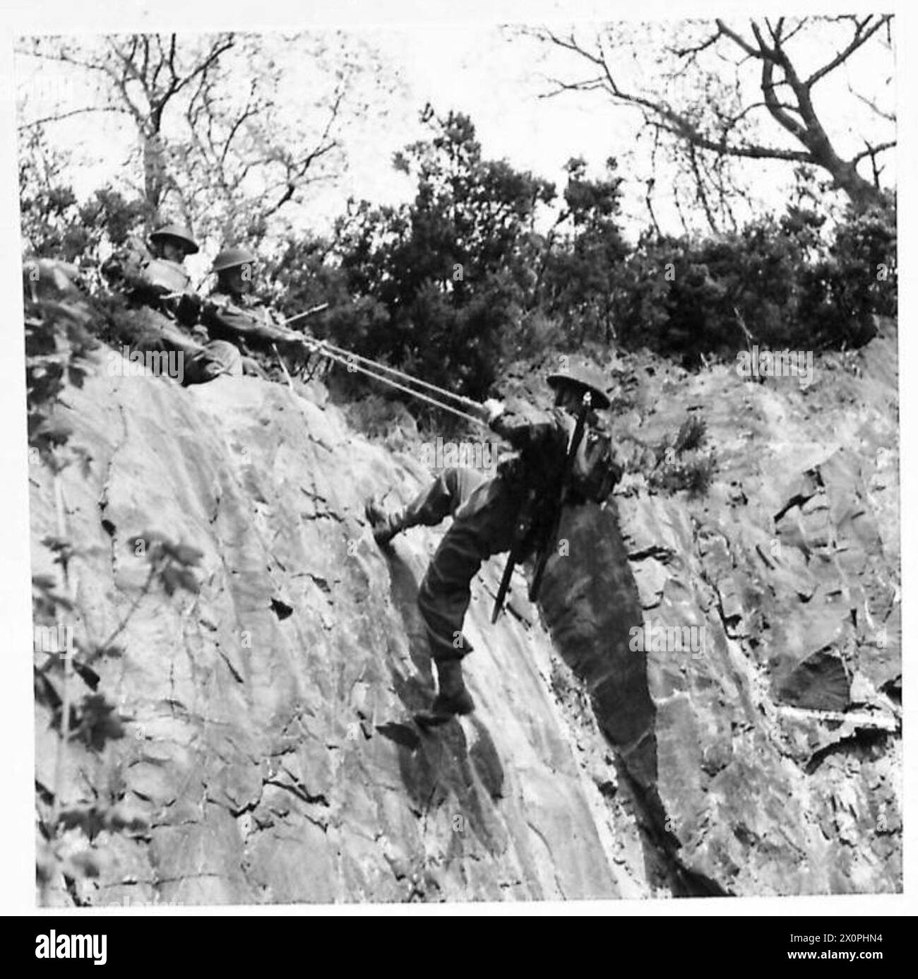 ROCK CLIMBING - Aided by ropes these lads have to scale a cliff face ...