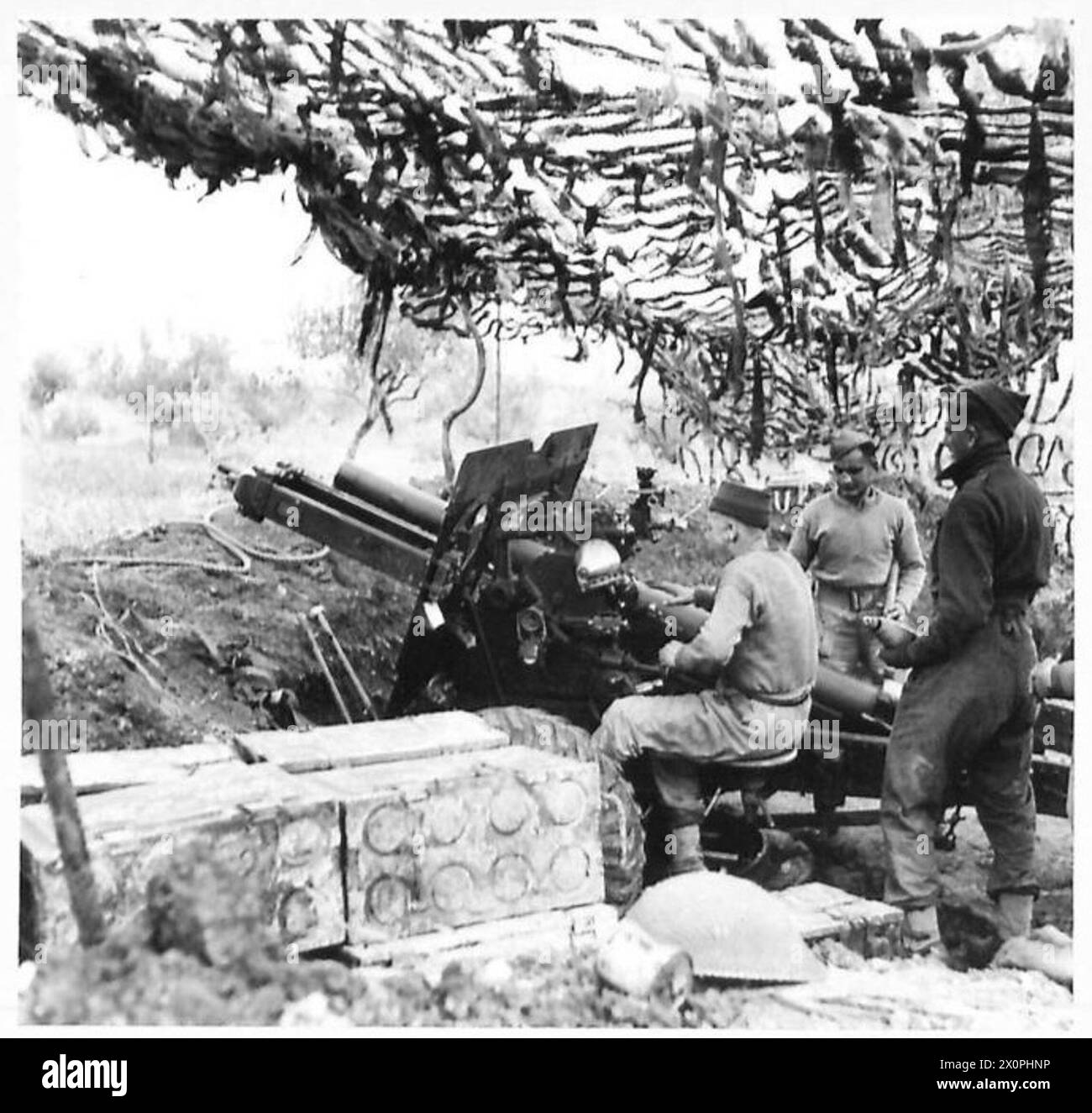 Newfoundland gunners of the Eighth Army fire a 25-pounder artillery gun ...