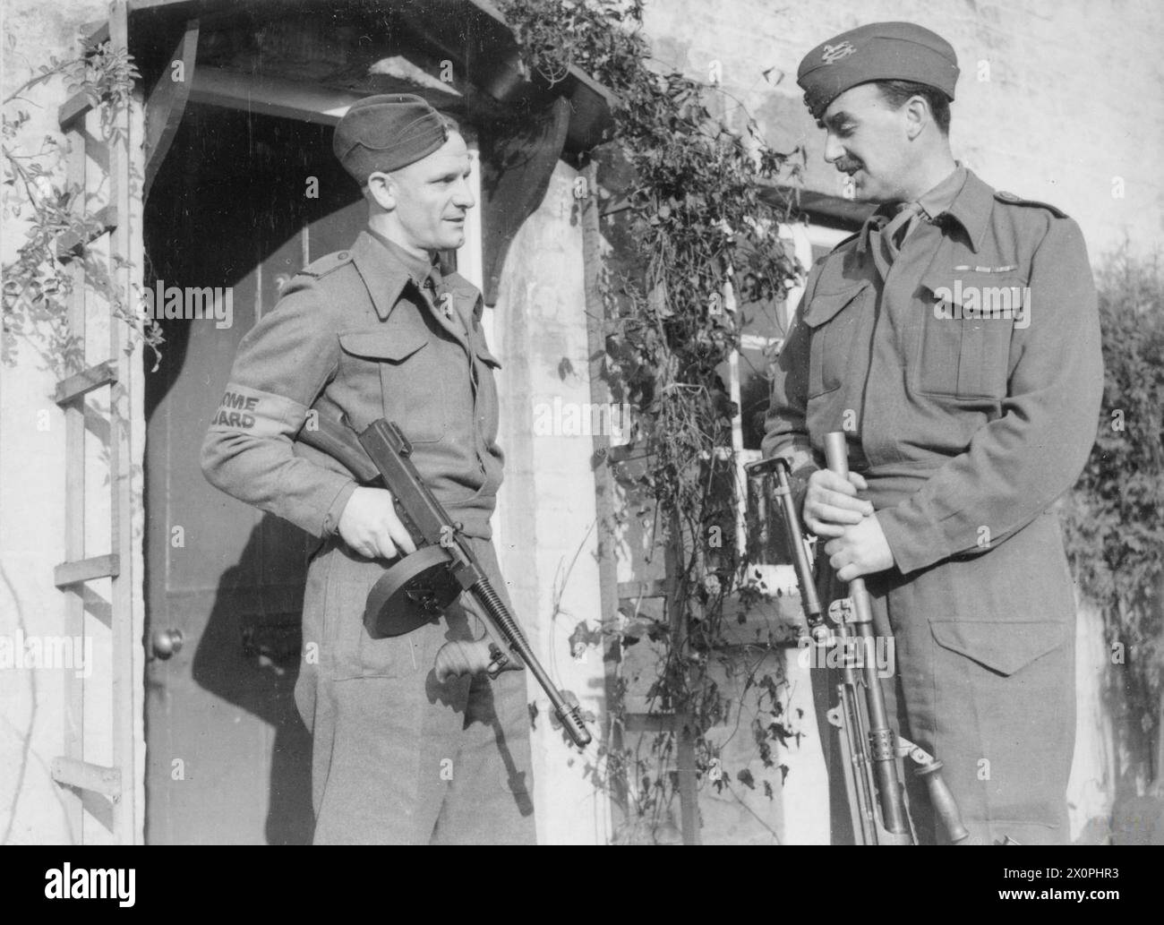 Two Home Guard members in Dorking are equipped with Bren and Thompson ...