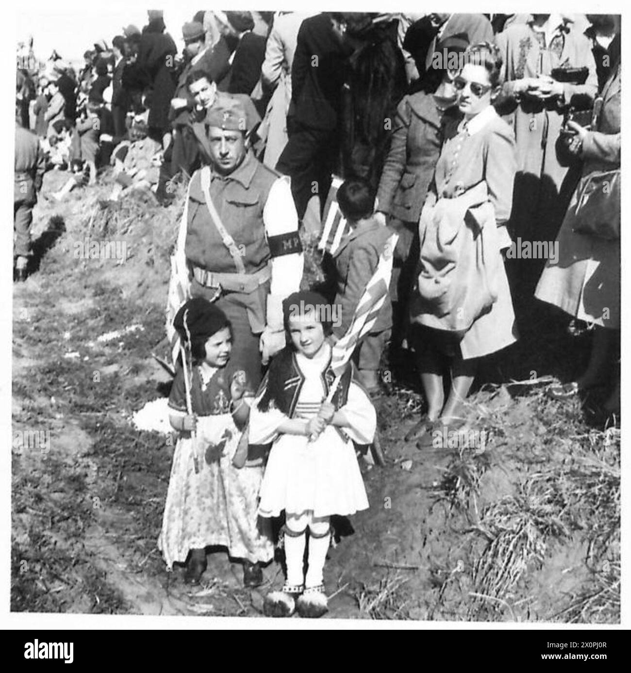 Photograph showing the Greek King visiting troops for National Day ...