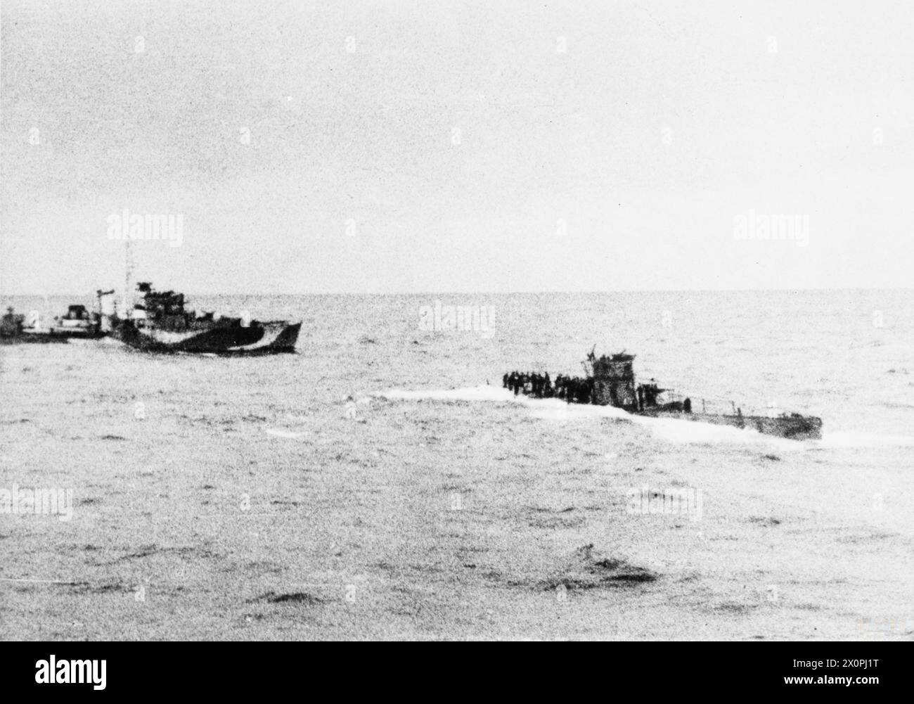HMS Easton comes alongside a sinking German U-boat during a hunt in the ...