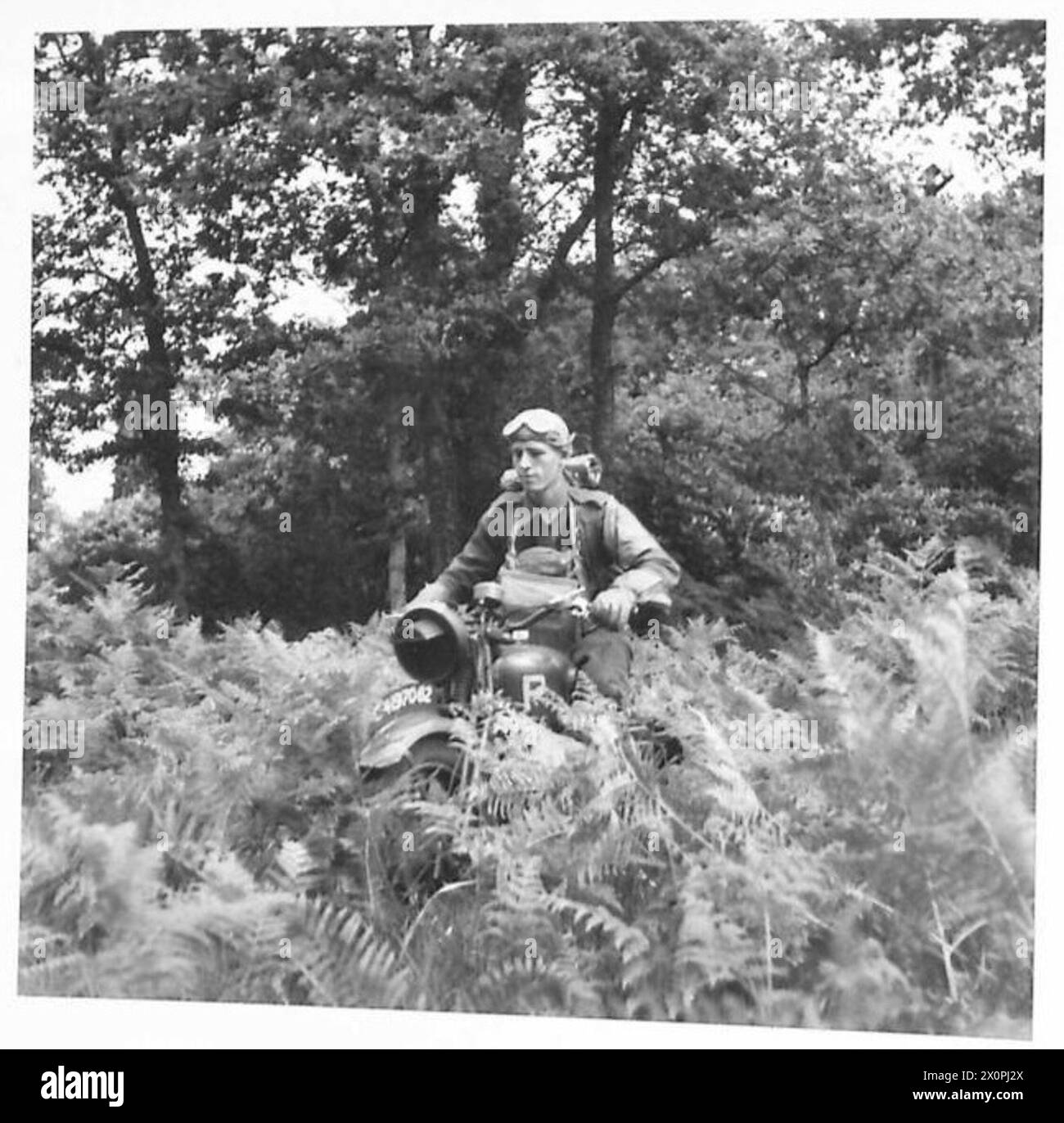 A motorcyclist scout patrols an aerodrome, reporting enemy positions to ...