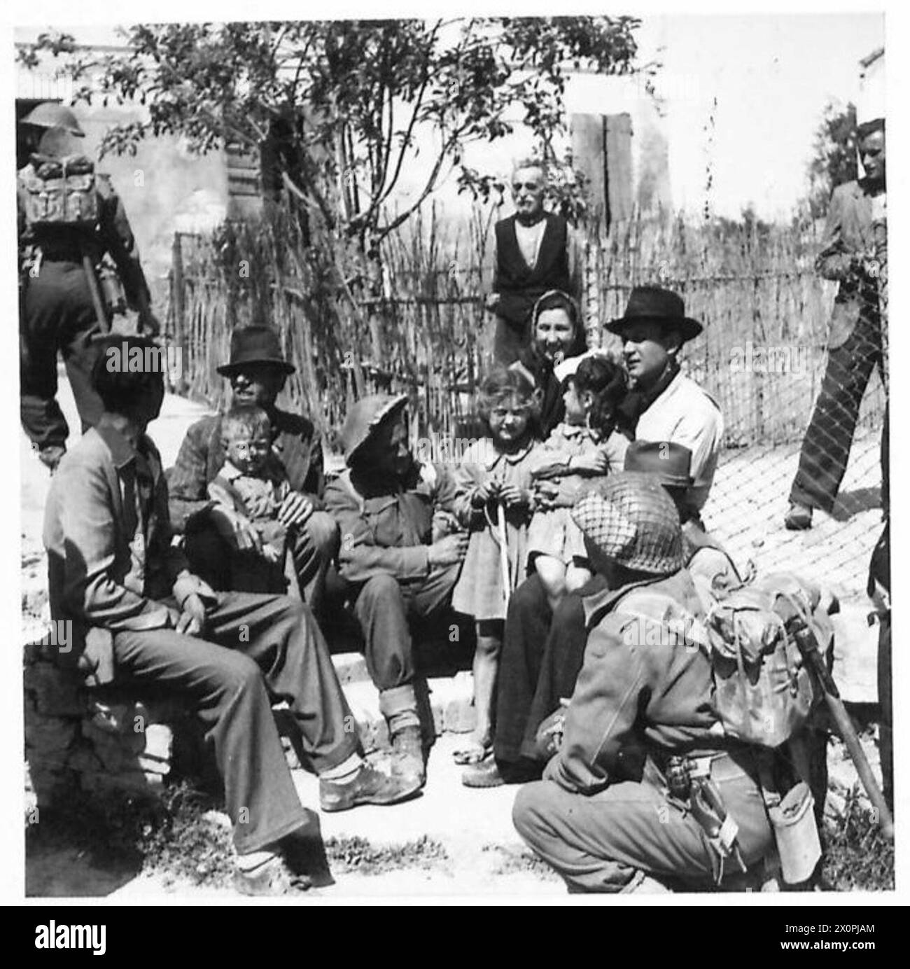 Soldiers interaction with civilians Cut Out Stock Images & Pictures - Alamy
