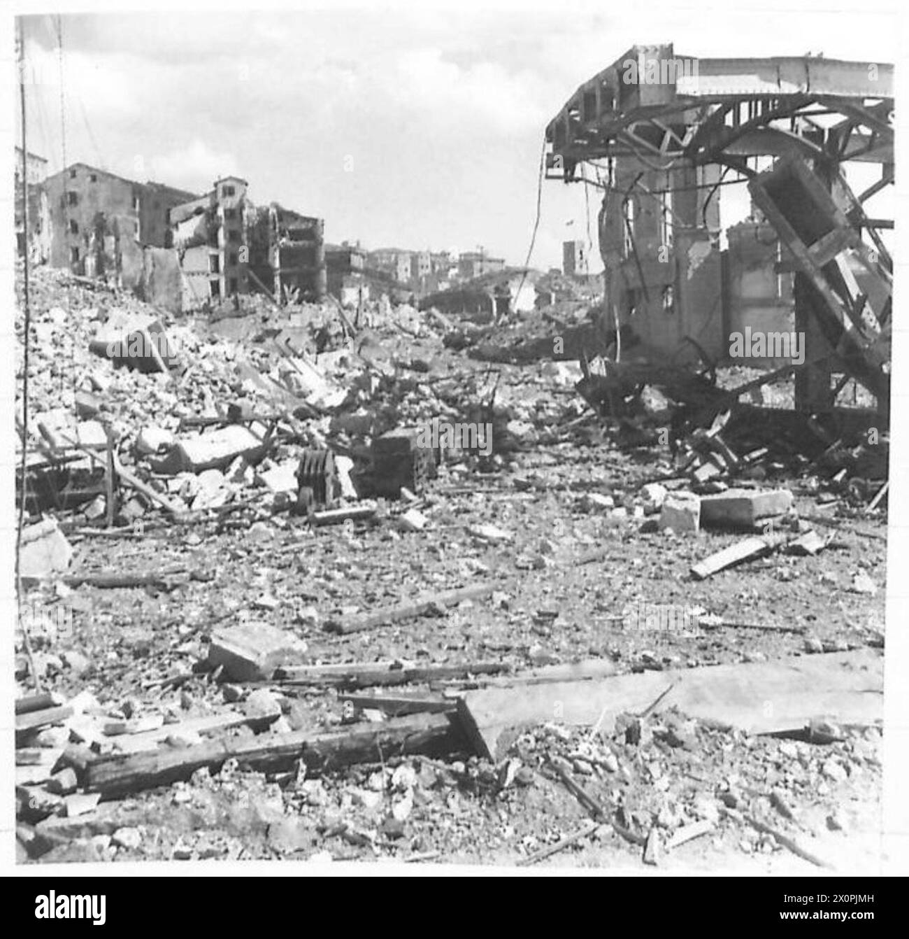 Photograph shows bomb damage on a section of a quay, including the ...