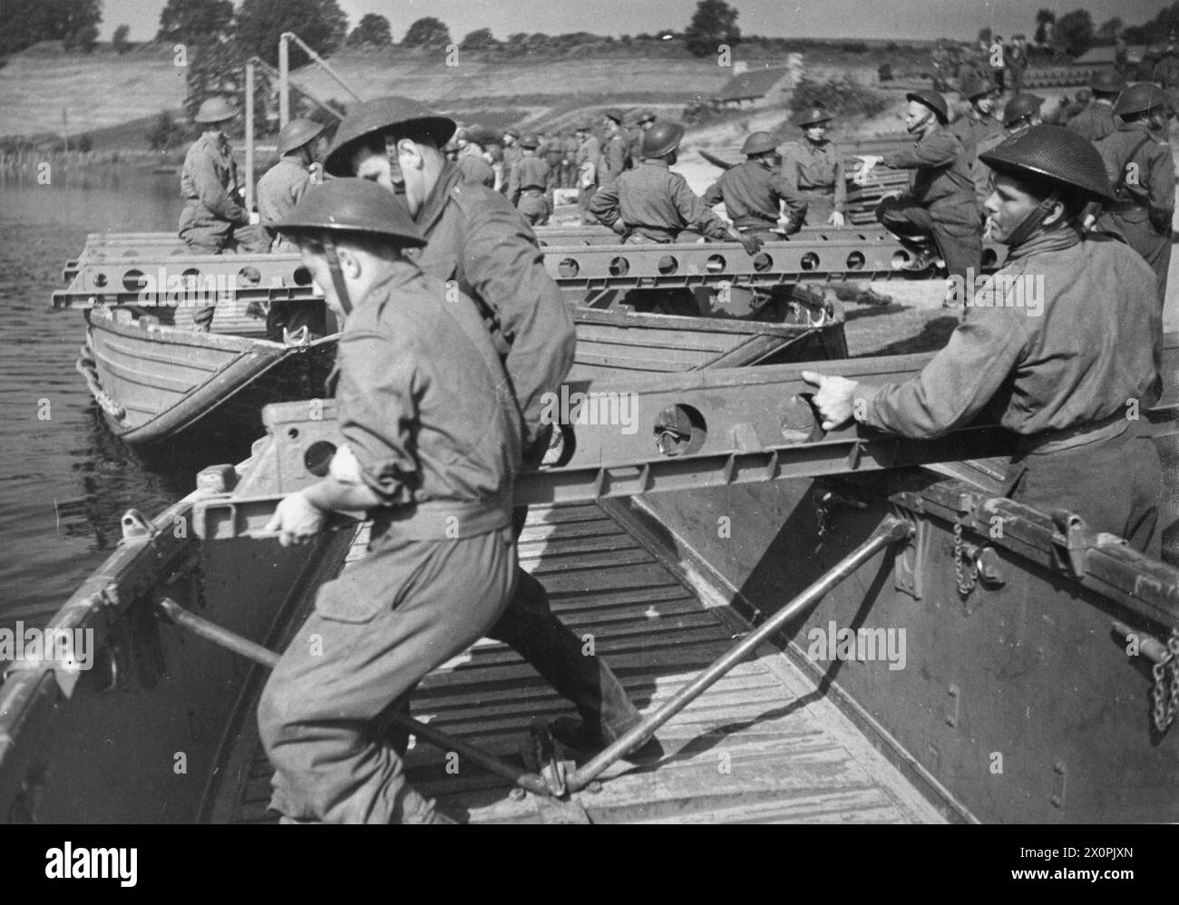 Engineers of the 1st Polish Corps fit pontoon bridge girders during ...
