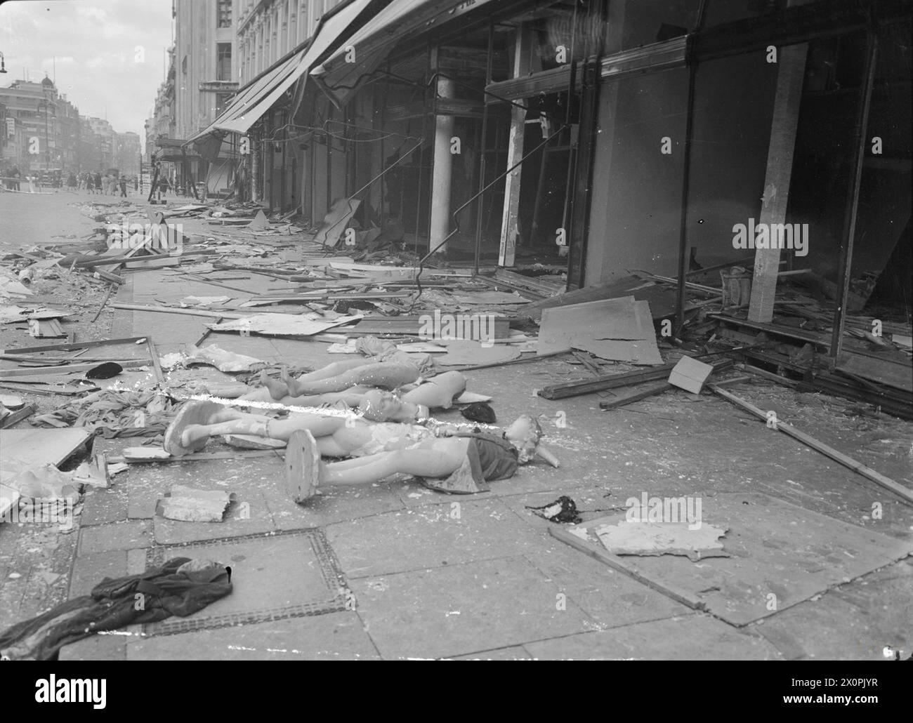 Air raid damage in London, 1940: debris litters the pavement outside ...