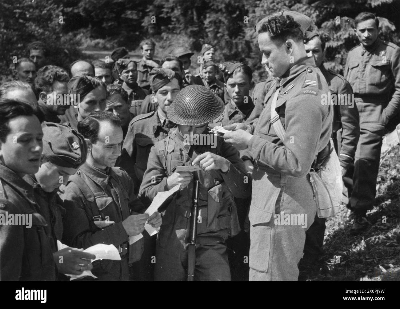 Master Corporal of the 1st Independent Parachute Brigade distributes ...