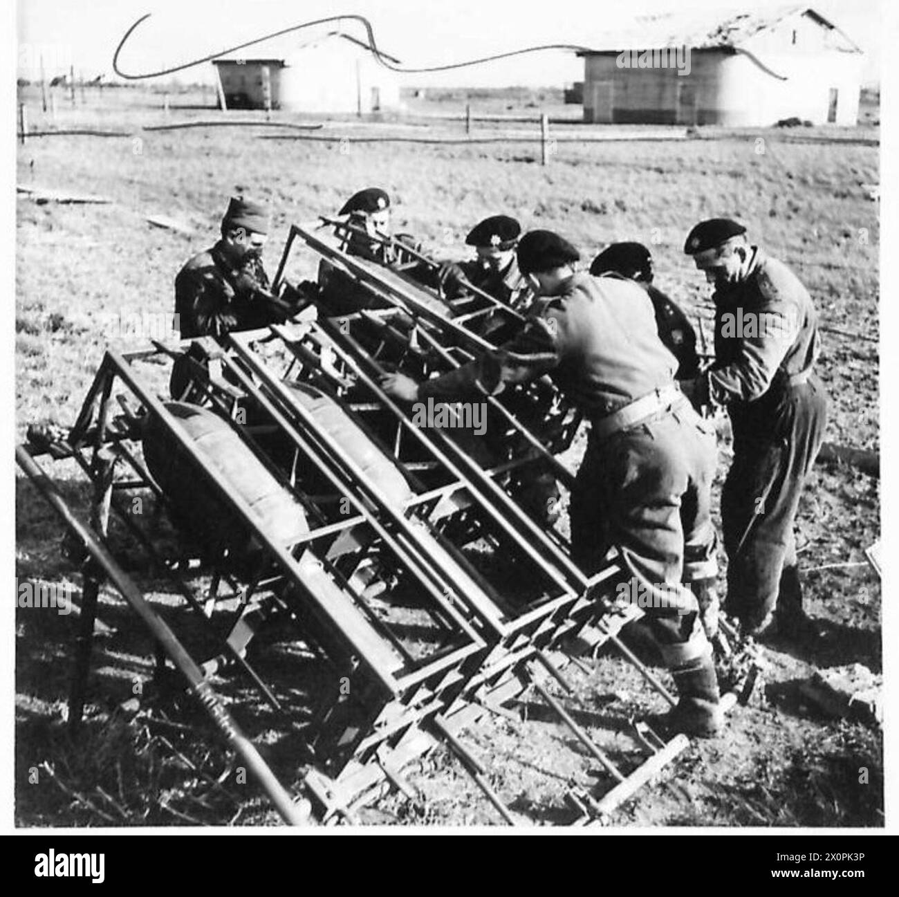 Photograph showing 3-cwt demolition mines in a cradle, prepared for ...