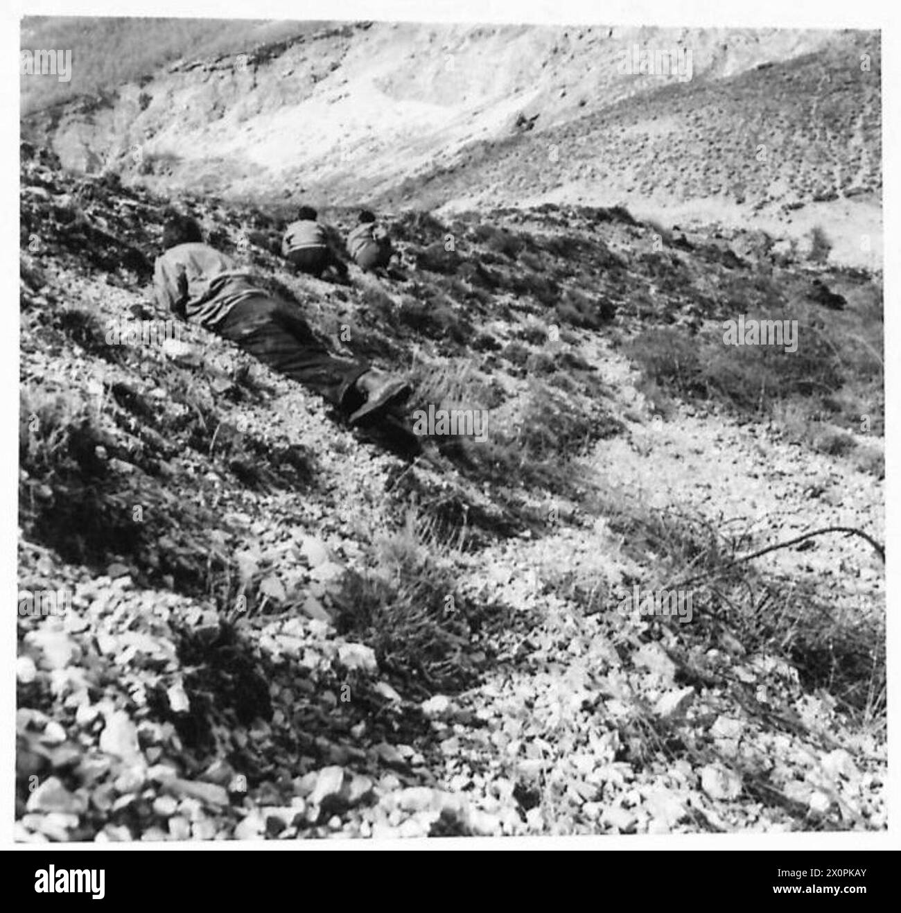 FIFTH ARMY : ITALIAN PARTISANS - Partisans crouch on the hillside as ...
