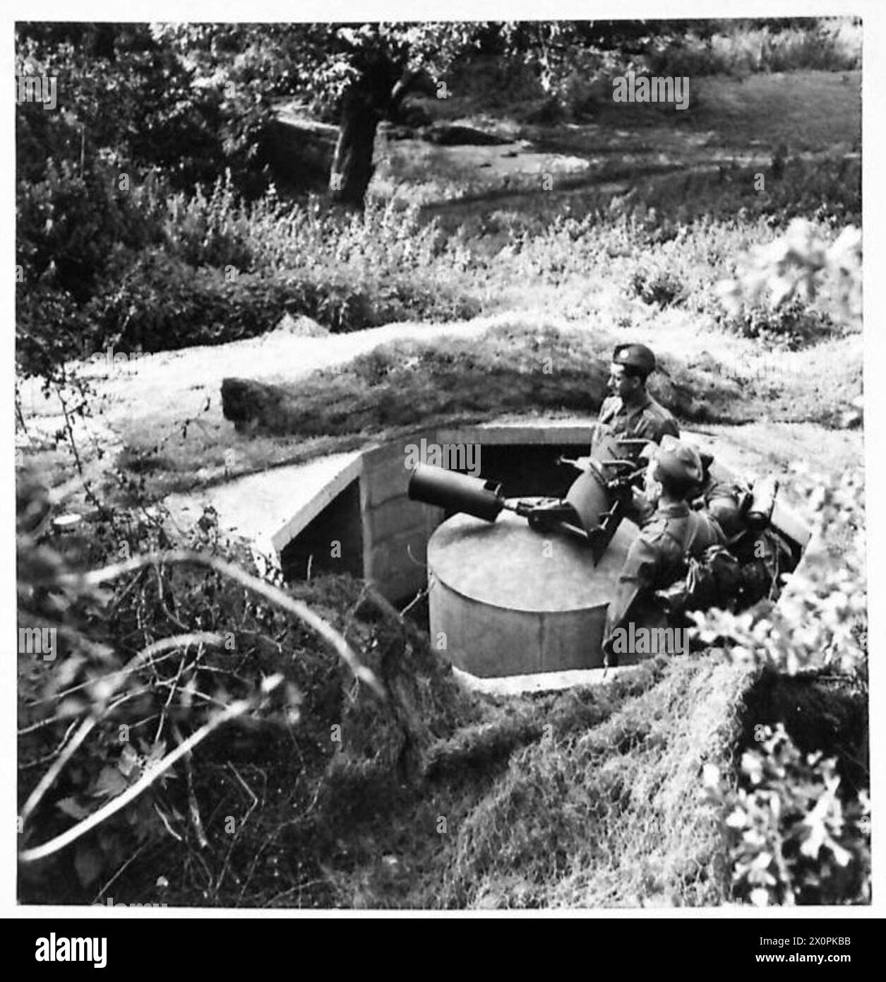 Home Guard members conduct a defensive exercise using a Spigot mortar ...