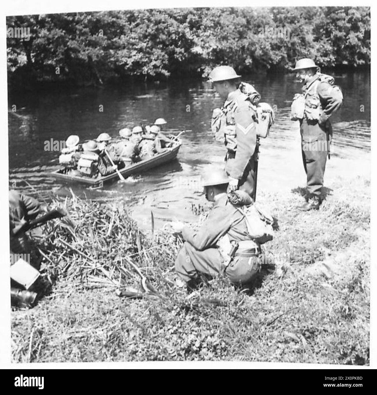 Home Guards embark in assault boats under supervision of Royal Marines ...