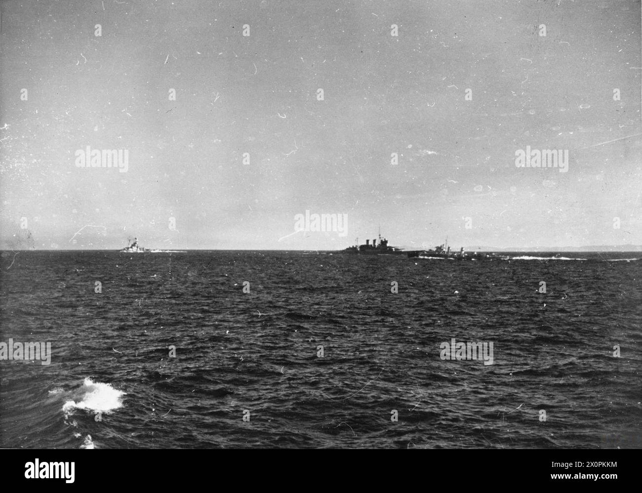 Destroyers are photographed in November 1940 aboard HMS Kelvin ...