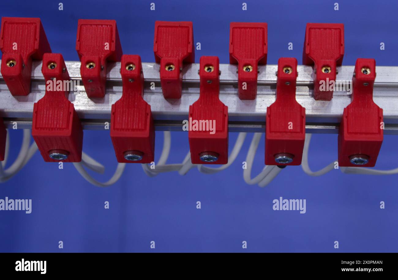 Red wire contacts on a blue background. Installation electrical cables ...