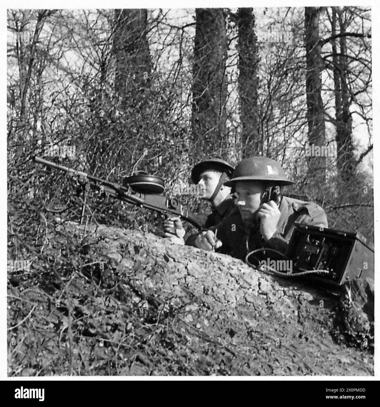 SIGNALLERS AT WORK IN THE FIELD - A field telephone in use by a ...