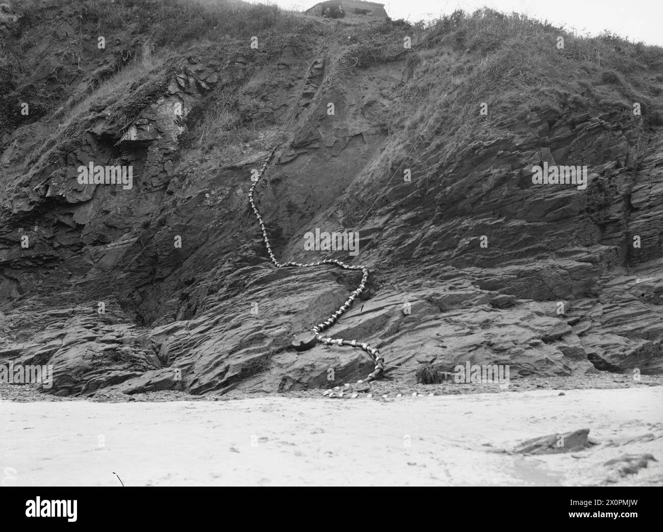 View of articulated piping on cliff face tail cables at Padstow on 12 ...