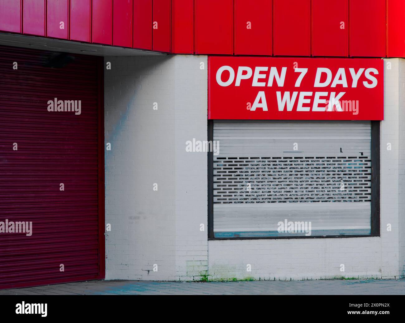 Open 7 days a week sign above business store front Stock Photo - Alamy