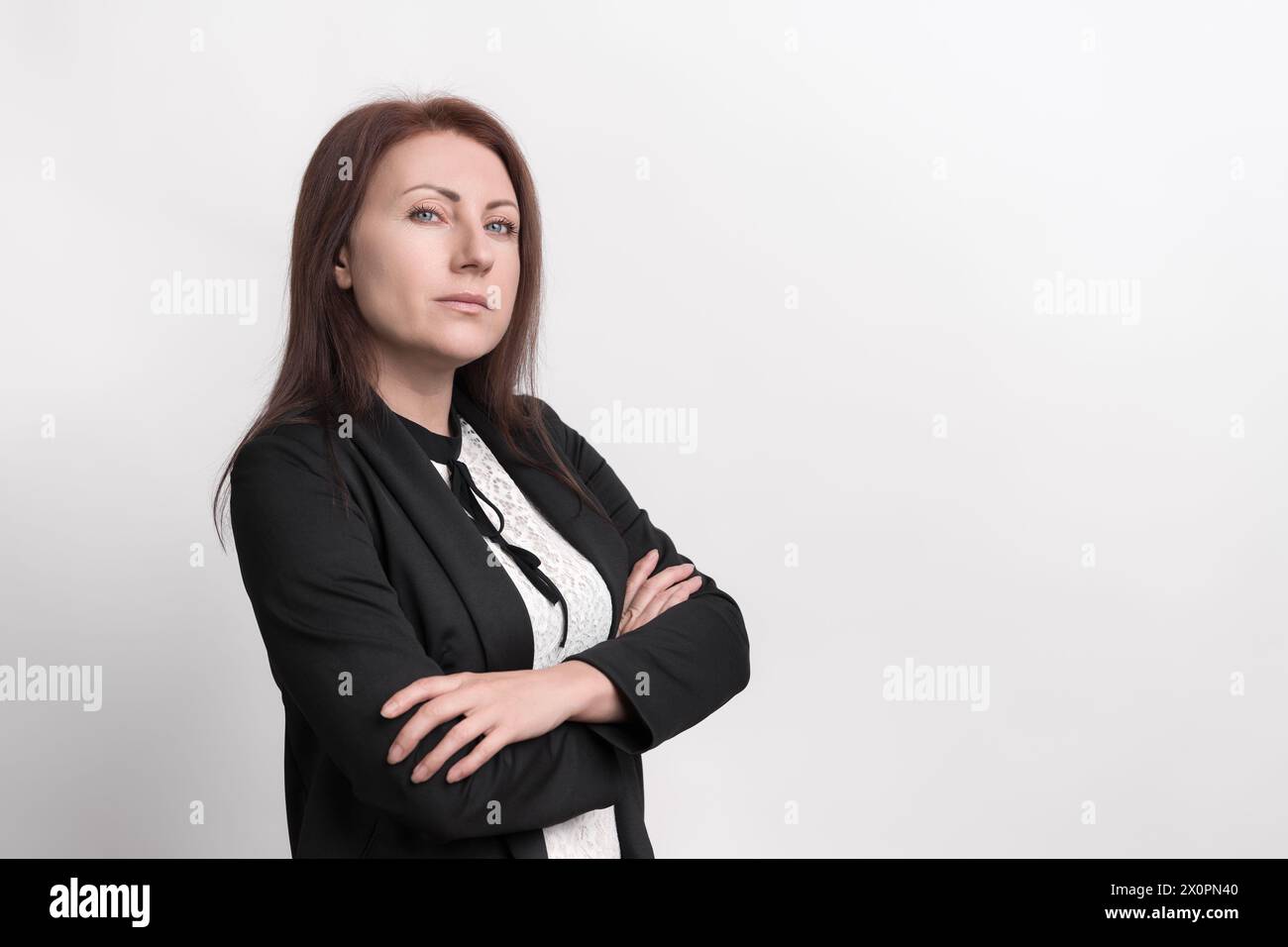 Formal portrait of confident businesswoman employee with arms crossed ...