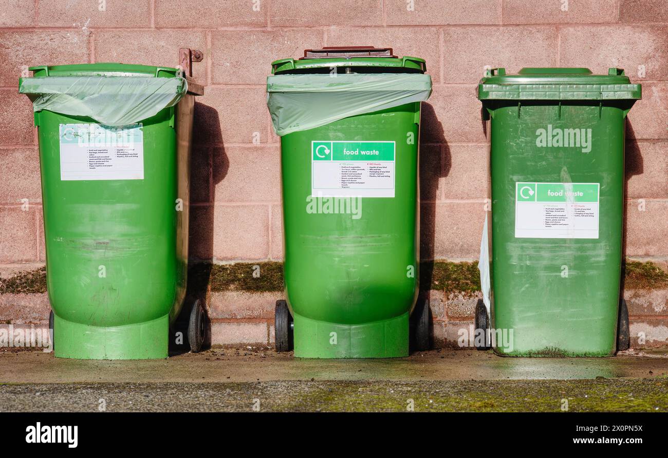 Wheelie bins in row segregated for recycling rubbish Stock Photo - Alamy