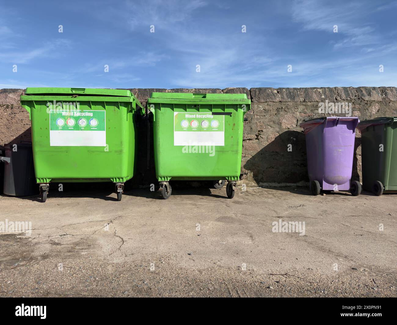 Wheelie bins in row segregated for recycling rubbish Stock Photo - Alamy