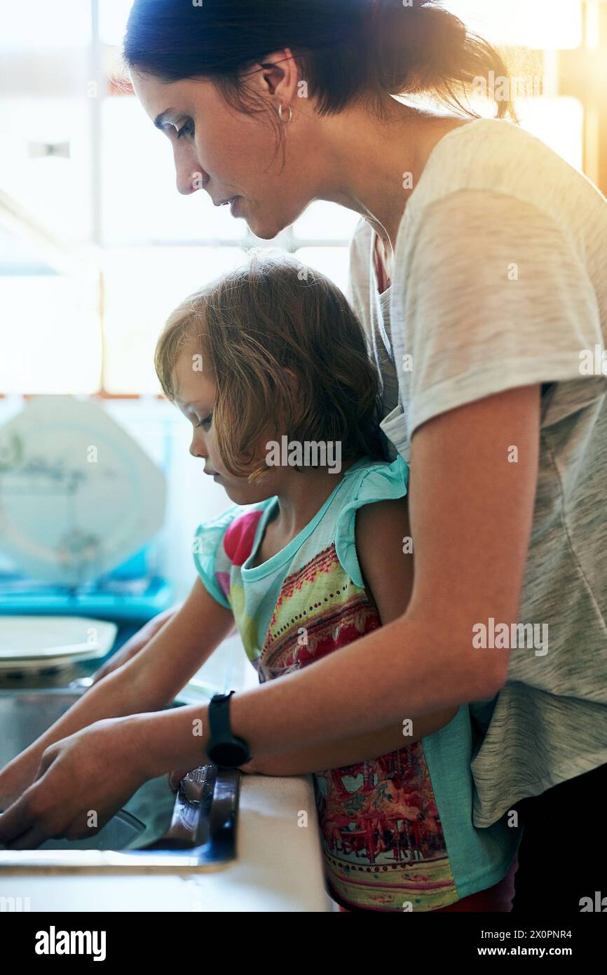 Washing, dishes and mom with girl, help and teaching chores, learning ...