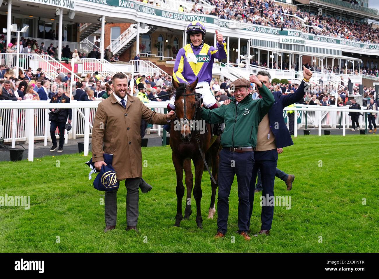 Jockey Charlie Todd (centre) celebrates winning the William Hill ...