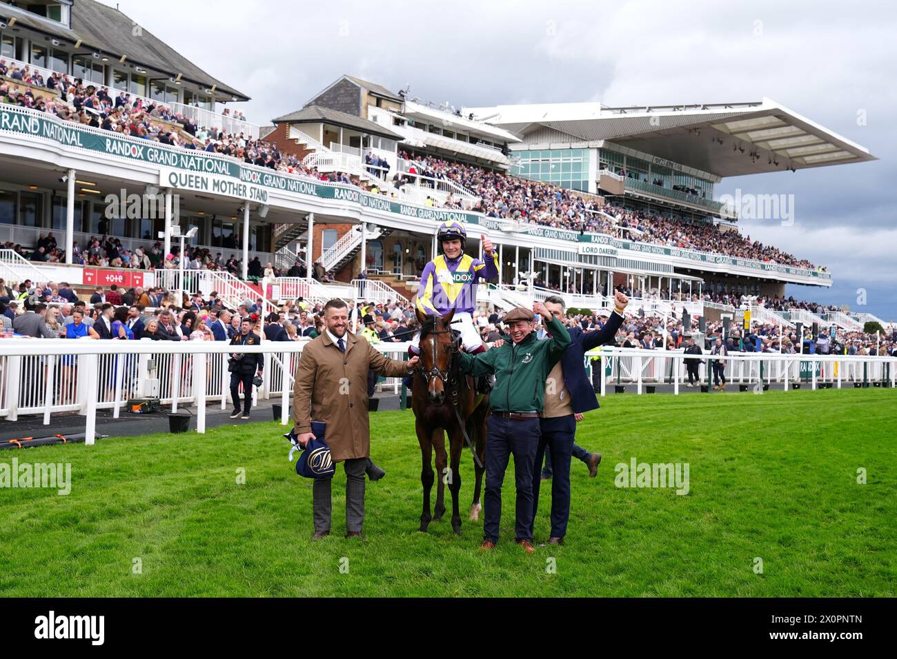 Jockey Charlie Todd (centre) celebrates winning the William Hill ...