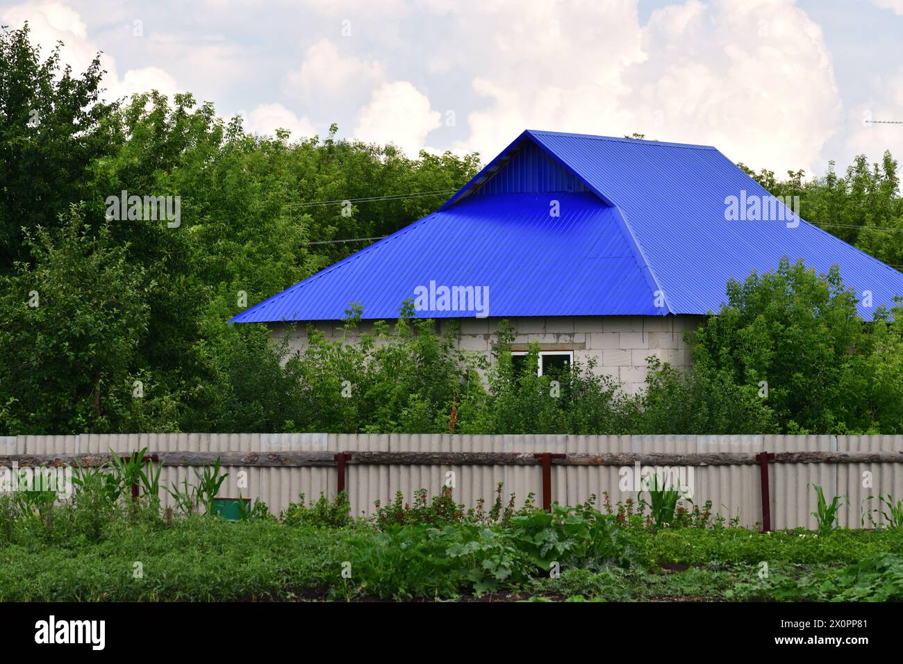 Rural house made of silicate brick with a metal roof, Russia Stock ...