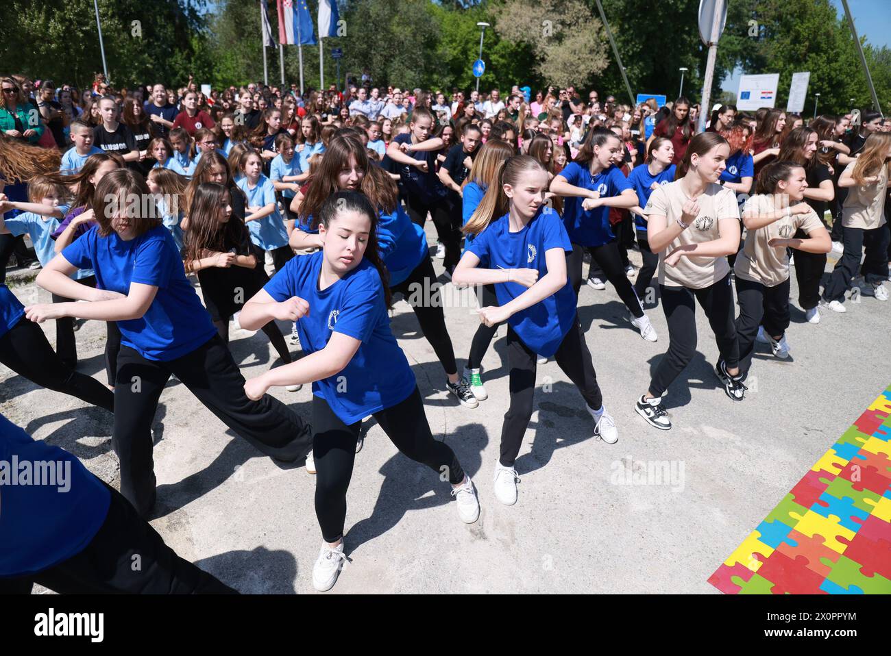 People dance in the rhythm of Rim Tim Tagi Dim song to show support to ...